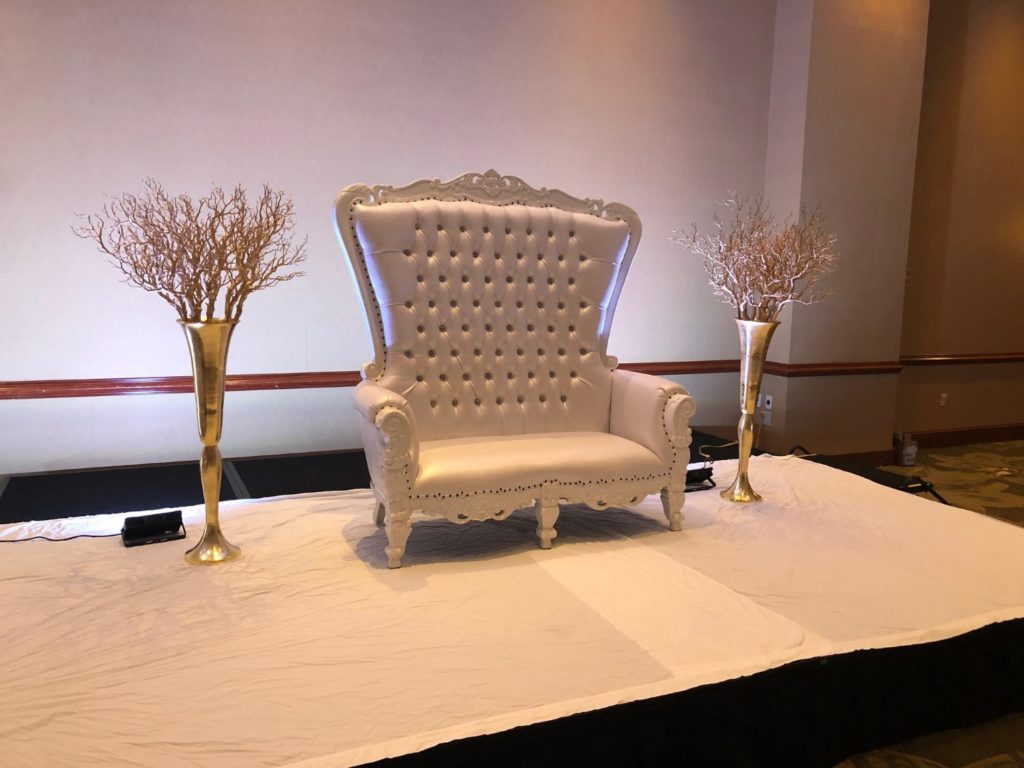 Stage-With-Chair-and-Decor | TRU Management